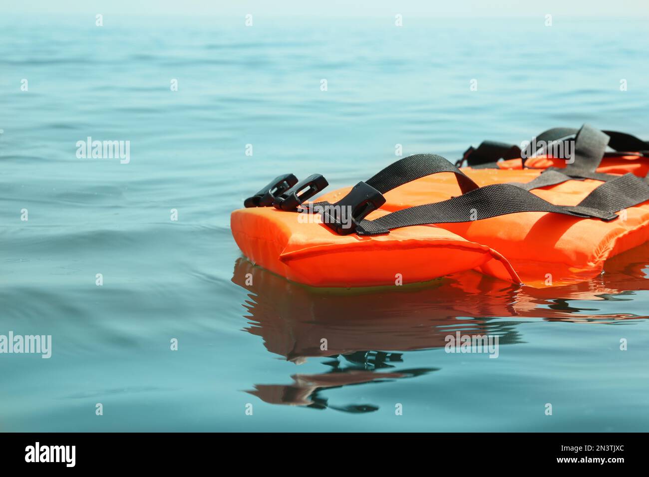 Orange life jacket floating in sea. Emergency rescue equipment Stock ...