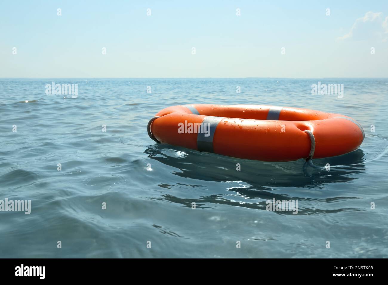 Orange life buoy floating in sea. Emergency rescue equipment Stock ...