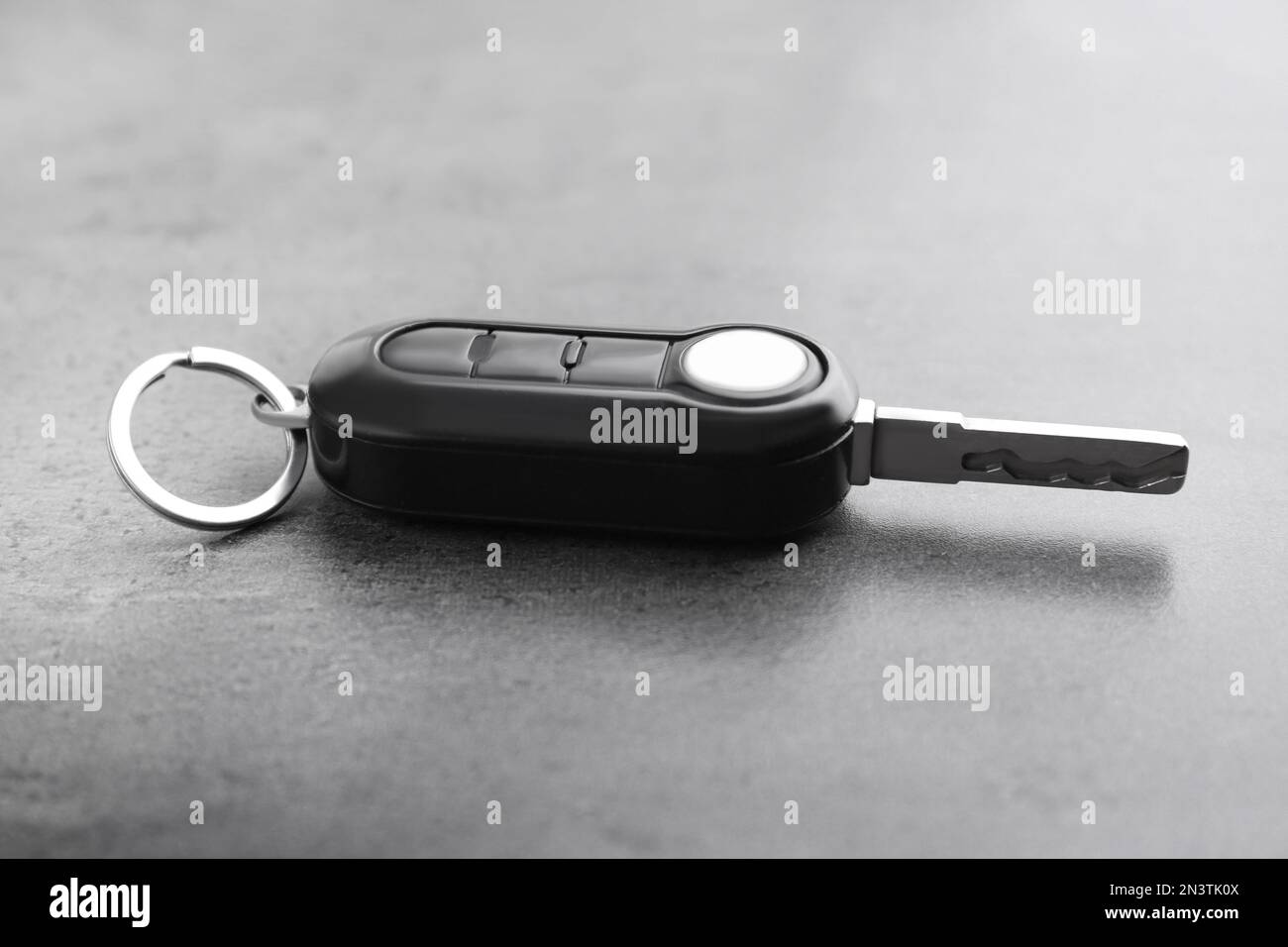 Modern car flip key on grey background Stock Photo - Alamy