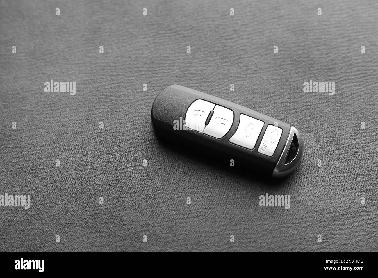Modern car smart key on grey fabric. Space for text Stock Photo - Alamy