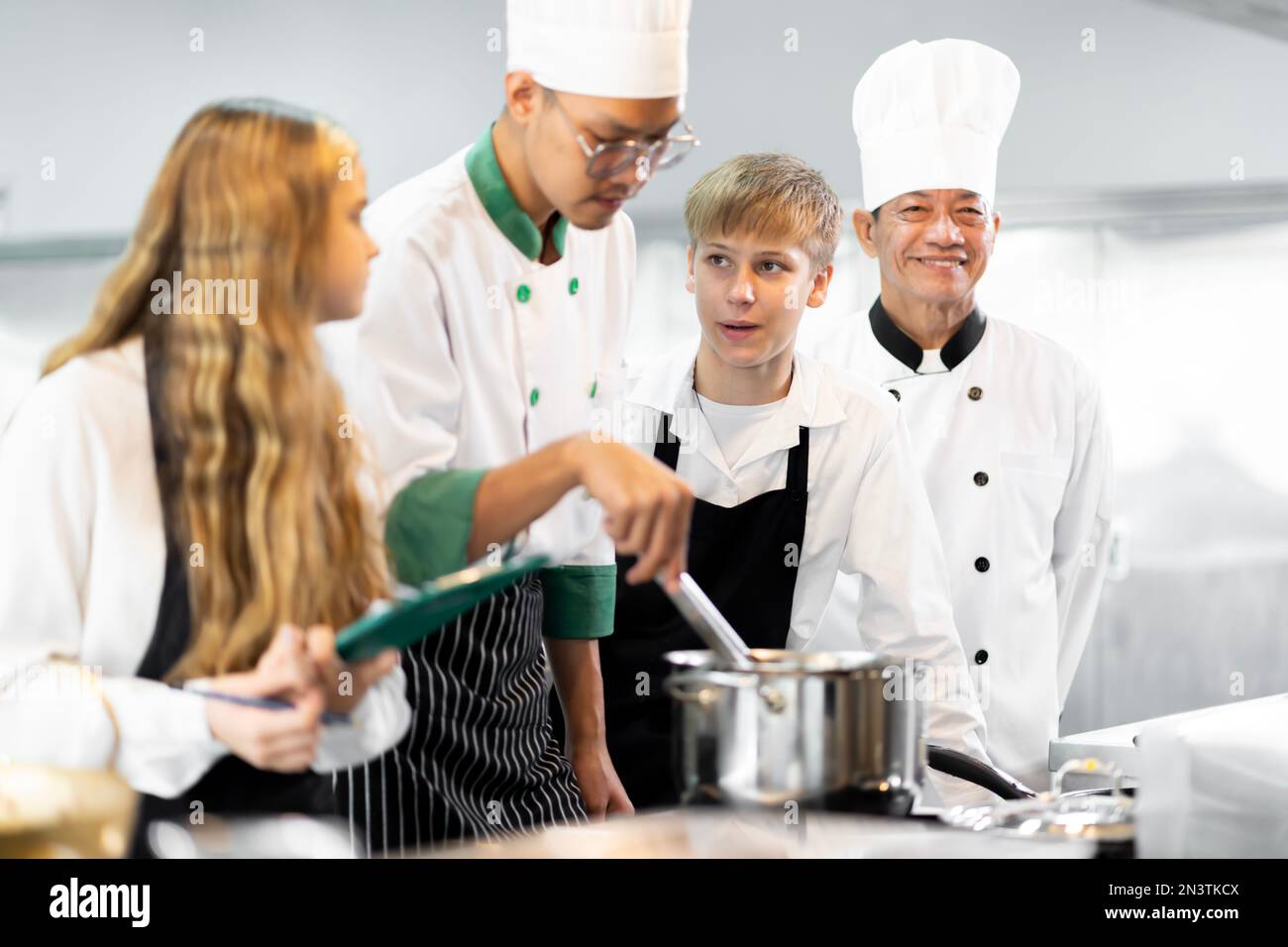 Students are learning to cook in a culinary institute with a standard ...