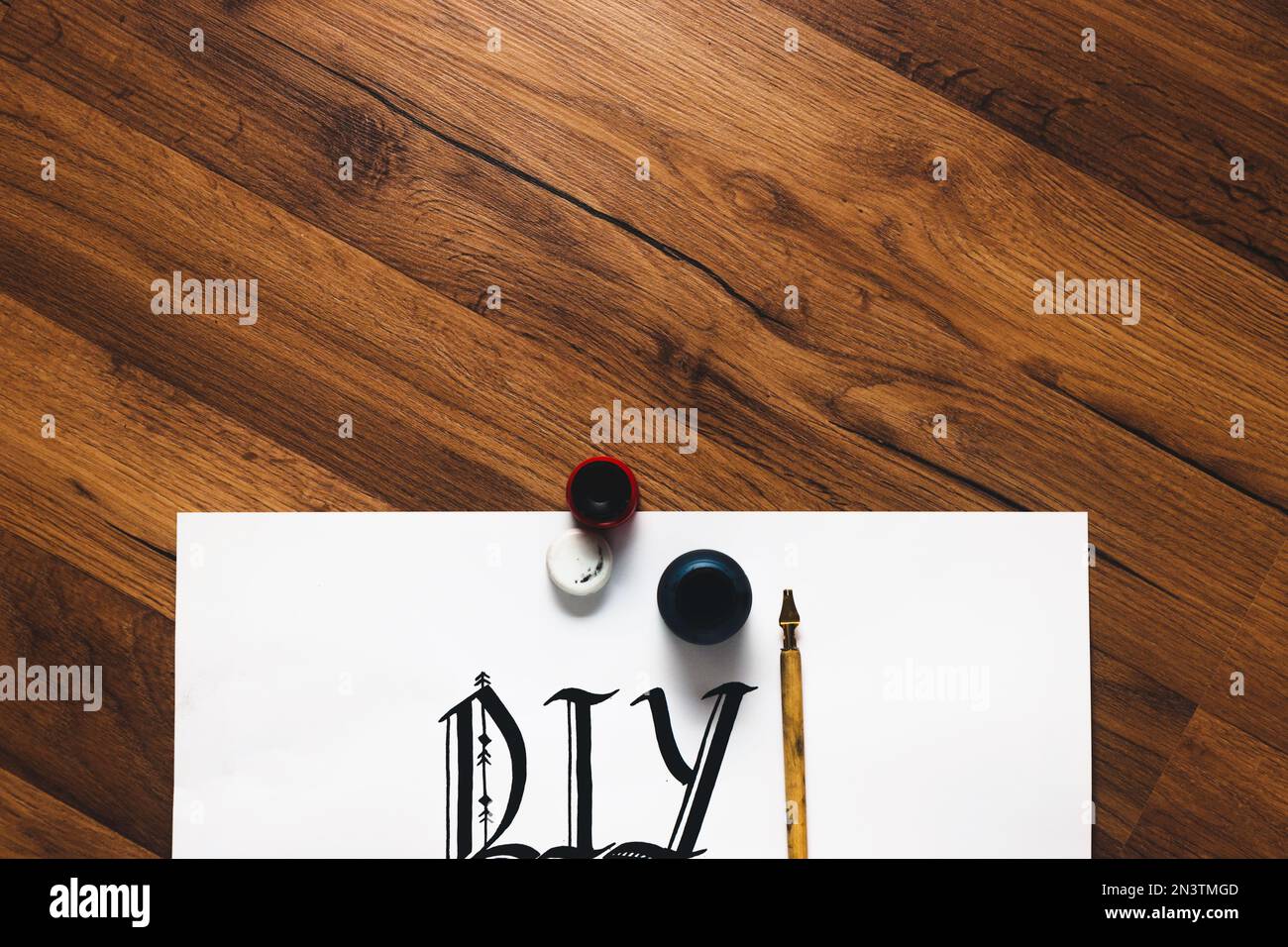 Sheet with diy word in calligraphy Stock Photo - Alamy