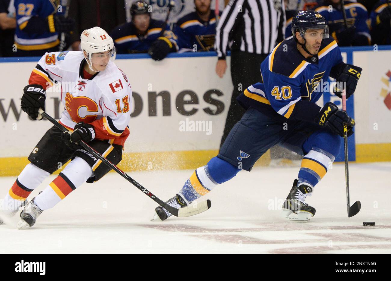 St. Louis Blues' Maxim Lapierre (40) gets by Calgary Flames' Johnny Gaudreau (13) during the ...