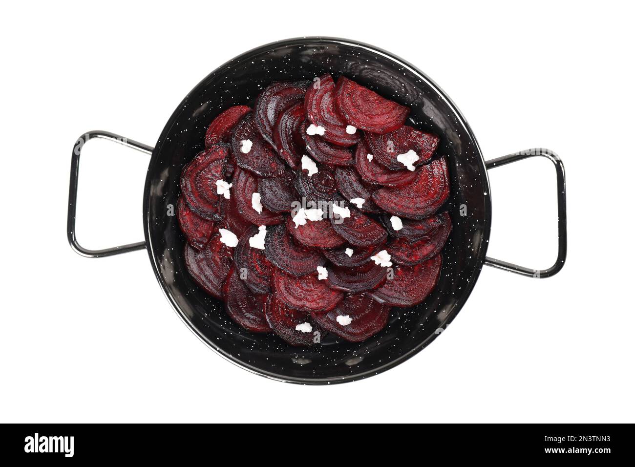 Roasted beetroot slices with feta cheese in wok pan isolated on white ...