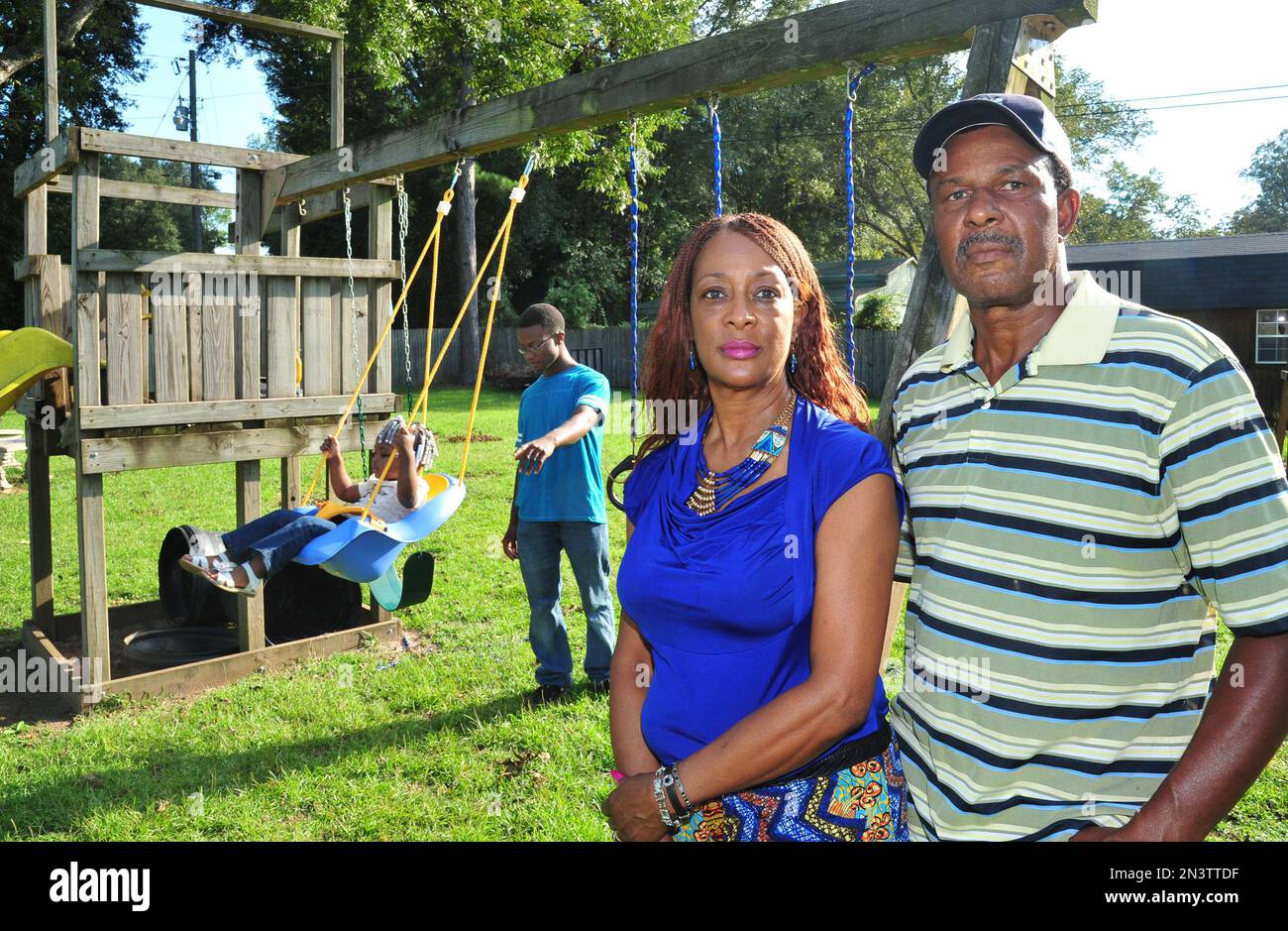 Lawrence Gaines, right, stands with his wife Troychelle Gaines in the yard of their south Albany ...