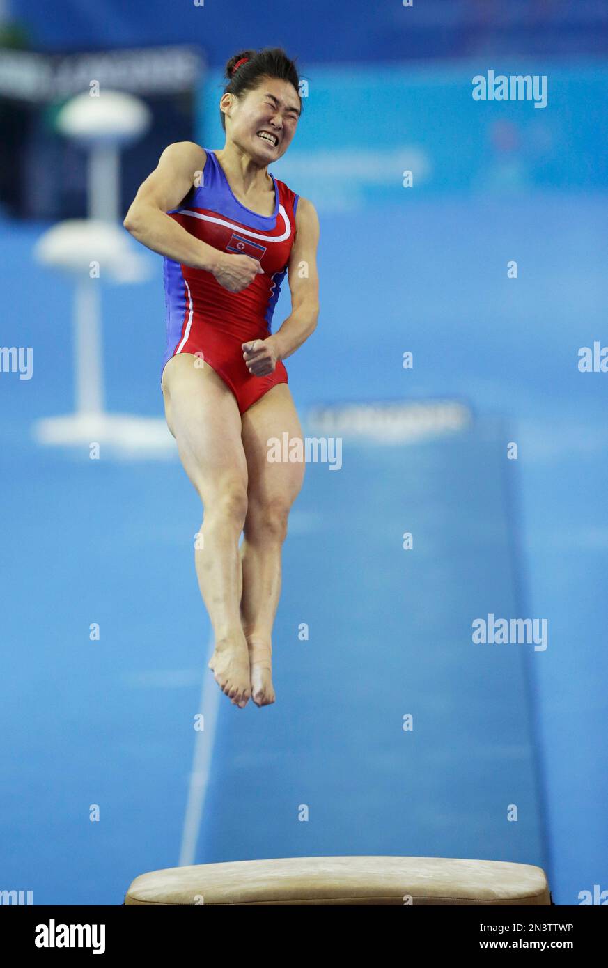 North Korea's Hong Un Jong jumps from the vault as she competes in the ...