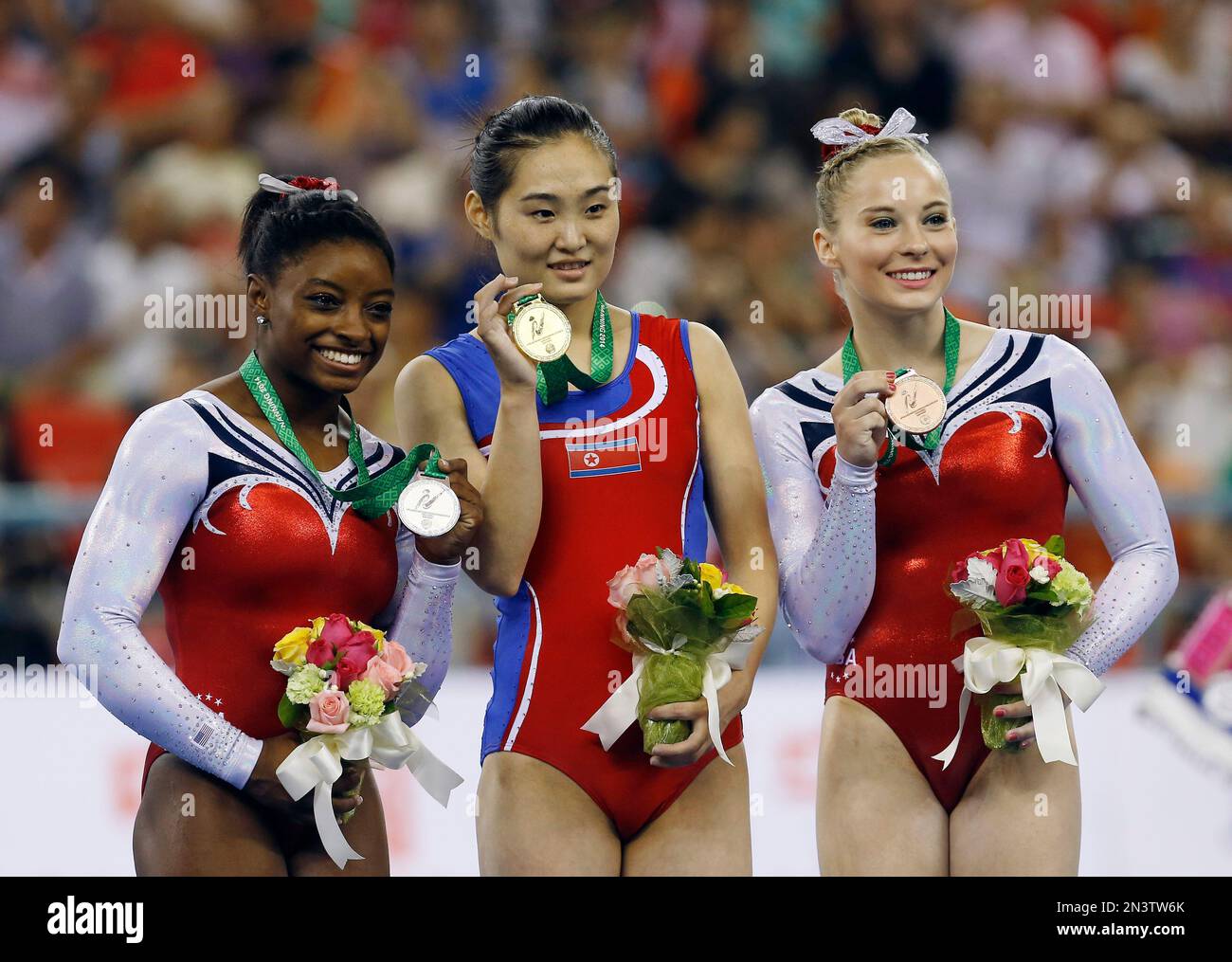 Gold medalist Hong Un Jong of North Korea, center, second place Simone ...
