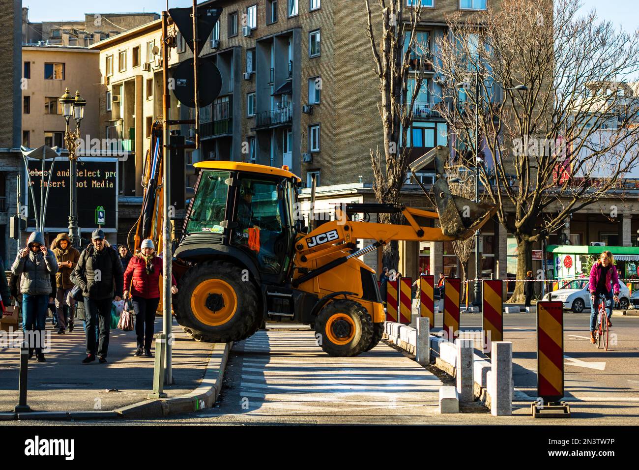 Excavator in traffic. industrial equipment at construction site in ...