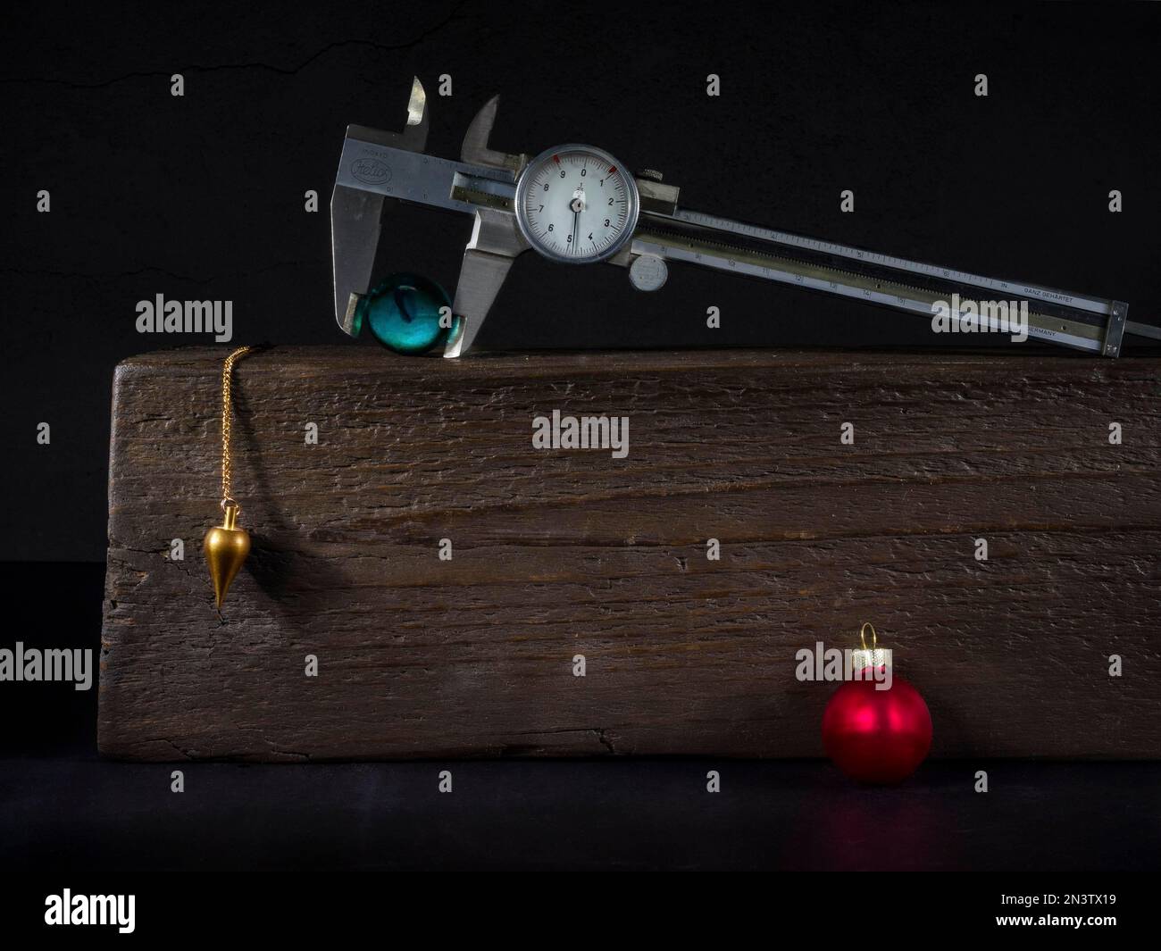 Still Life with Caliper, Glass Ball and Pendulum on Wooden Block Stock ...