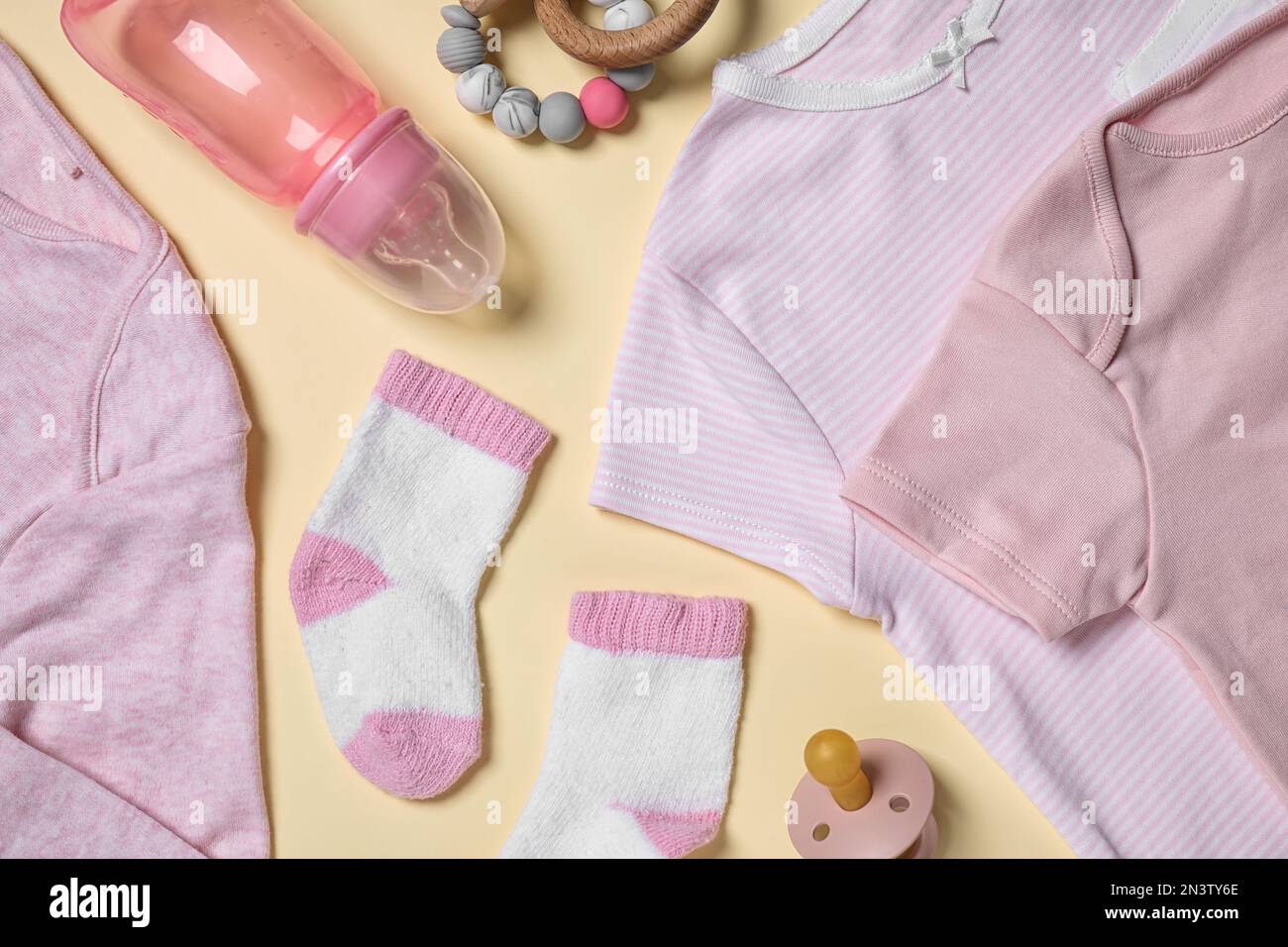 Flat lay composition with cute baby items on beige background Stock ...