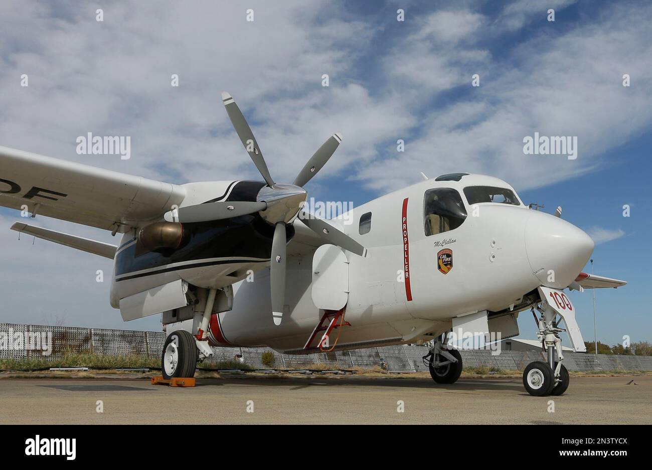 An twin-engine S-2T air tanker sits on the tarmac at the California ...