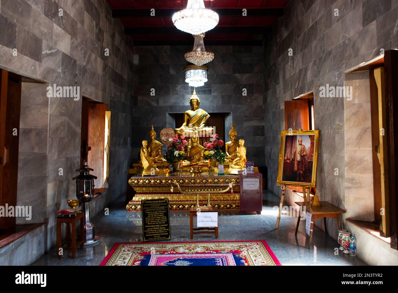 Ancient buddha statue in antique ubosot ordination hall for thai people ...
