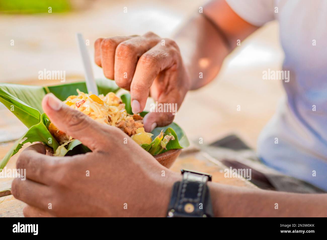 Person at table hi-res stock photography and images - Alamy