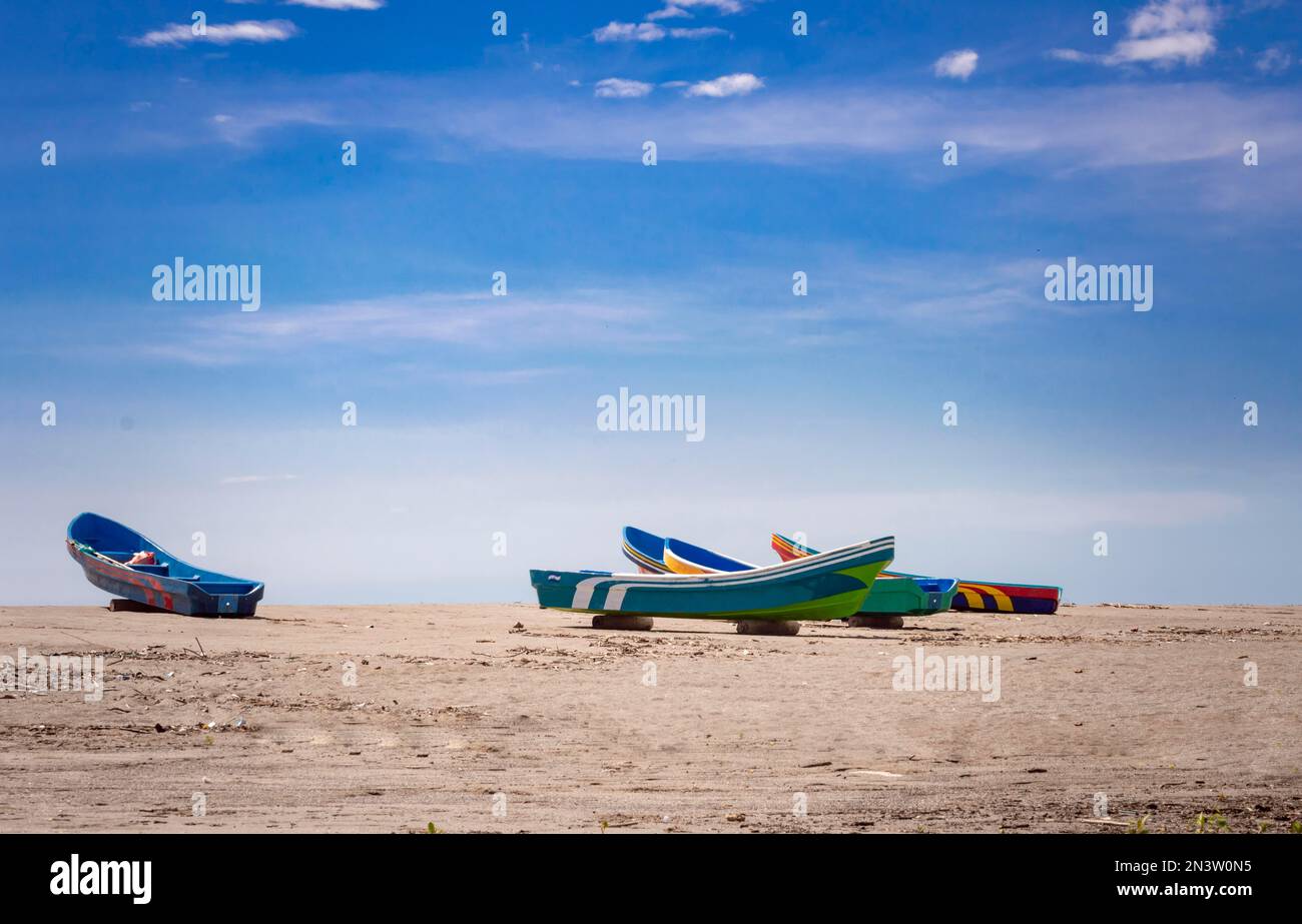 Four boats parked on the sand, fishing boats parked near the ocean ...