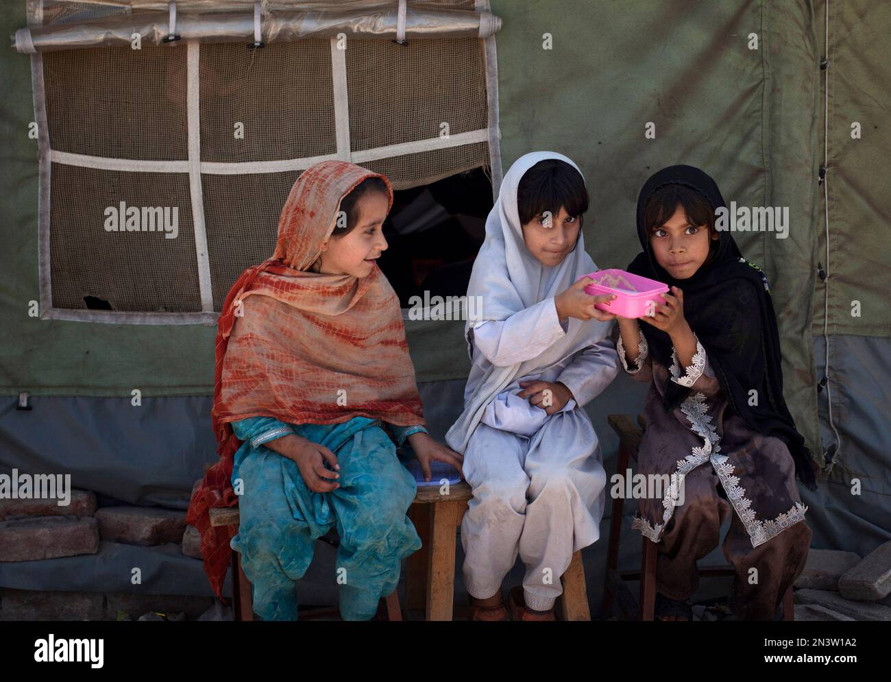 FILE - In this May, 26, 2010 file photo, Pakistani students share their ...