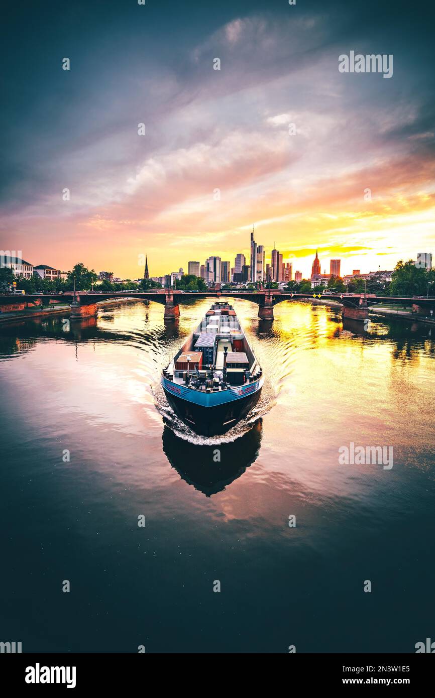 View from the Floeserbruecke over the river Main with container ship ...