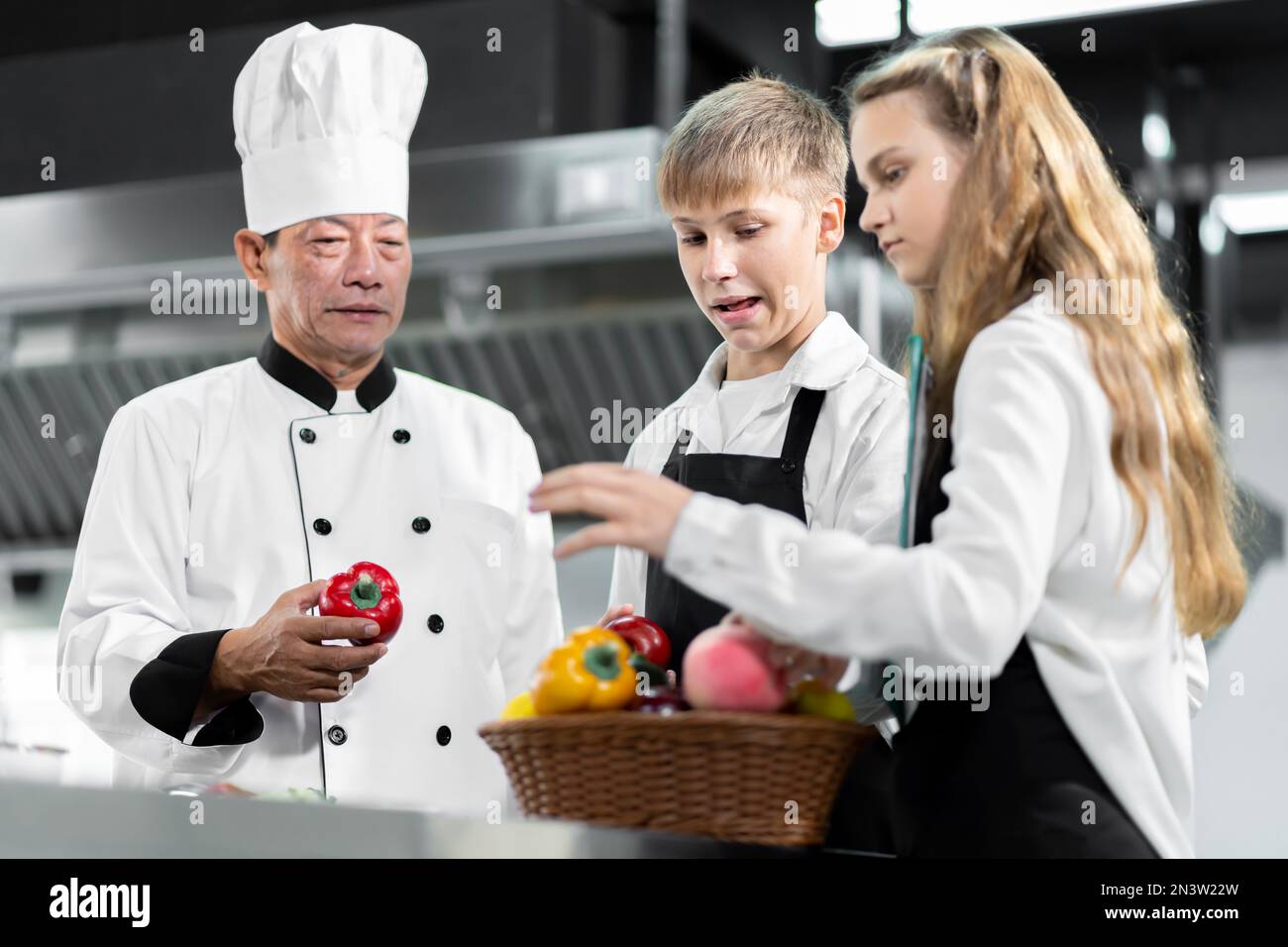 Chef teaching students asian hi-res stock photography and images - Alamy