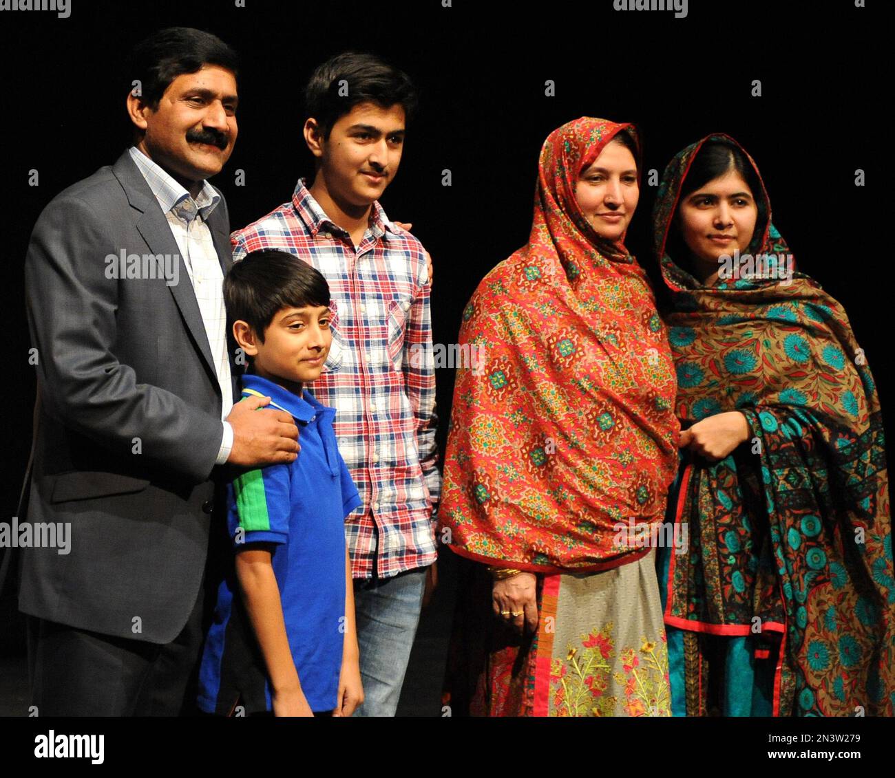 Nobel Peace Prize winner Malala Yousafzai, right, stands with her ...