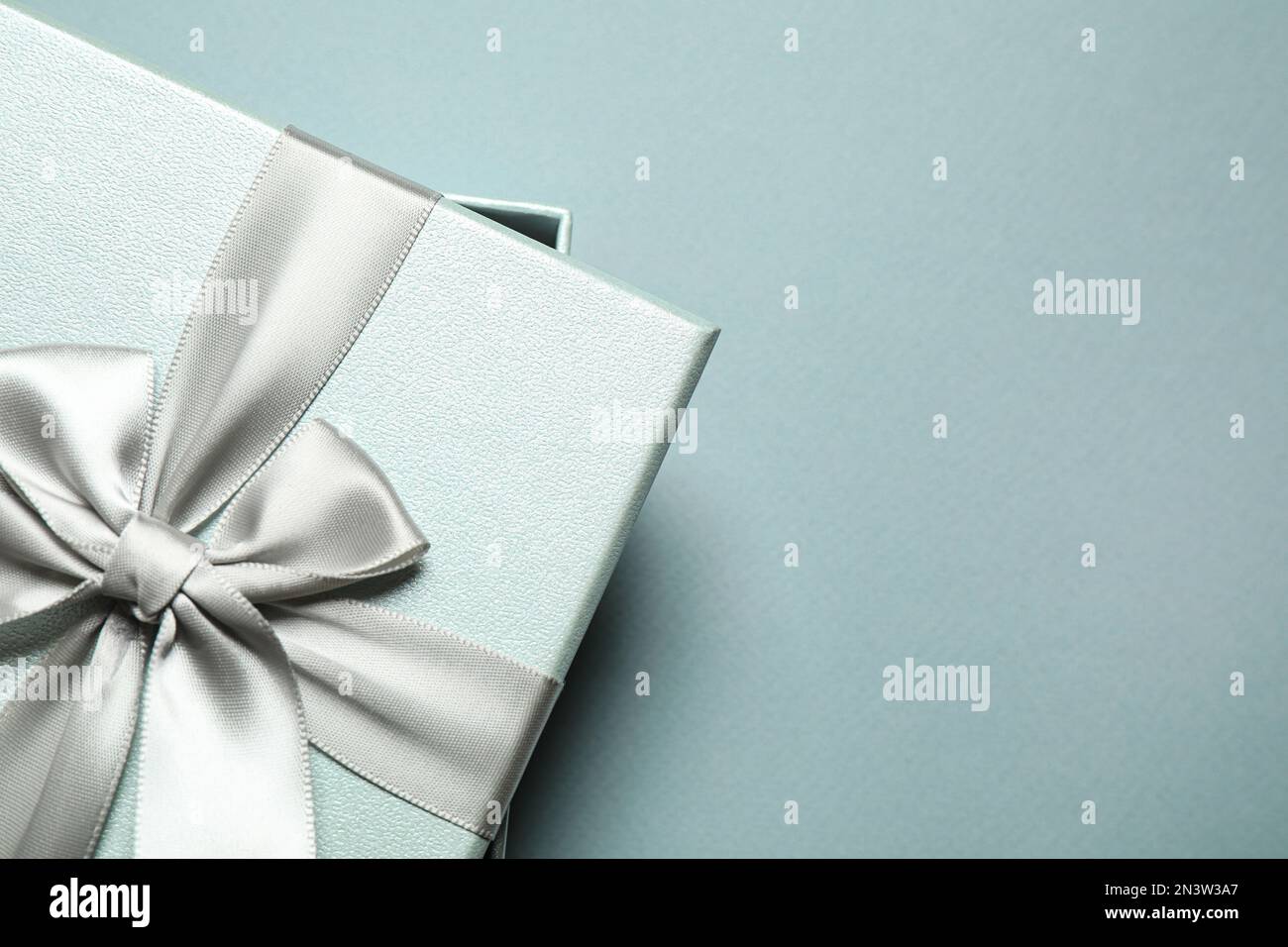 Beautiful gift box on grey background, top view. Space for text Stock ...