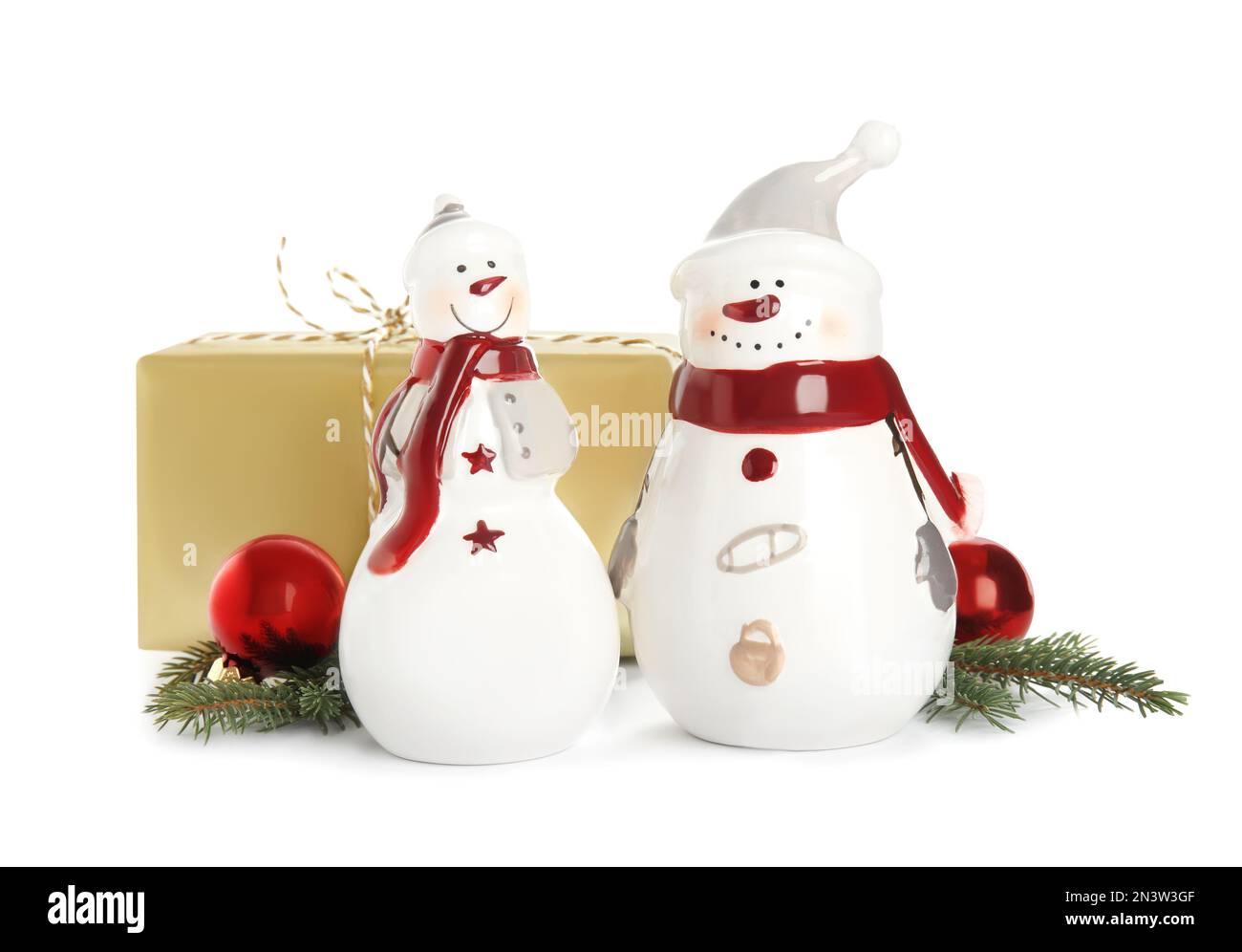 Christmas composition with decorative snowmen and gift box on white ...