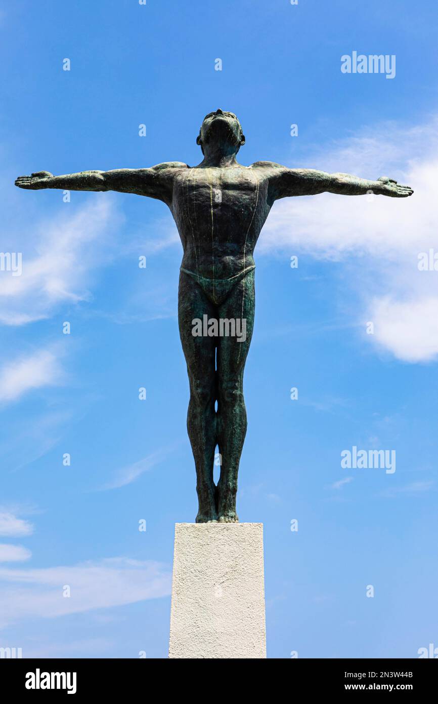Bronze statue of the swimmers, at the public outdoor pool at the port ...