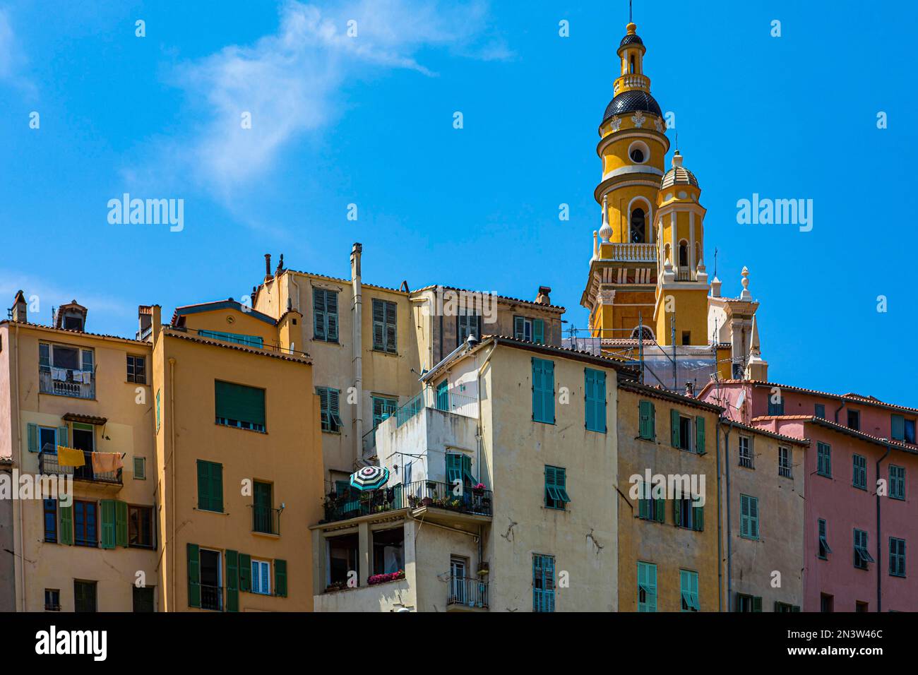 Colourful house facades, behind the Basilica Saint Michael Archangel ...