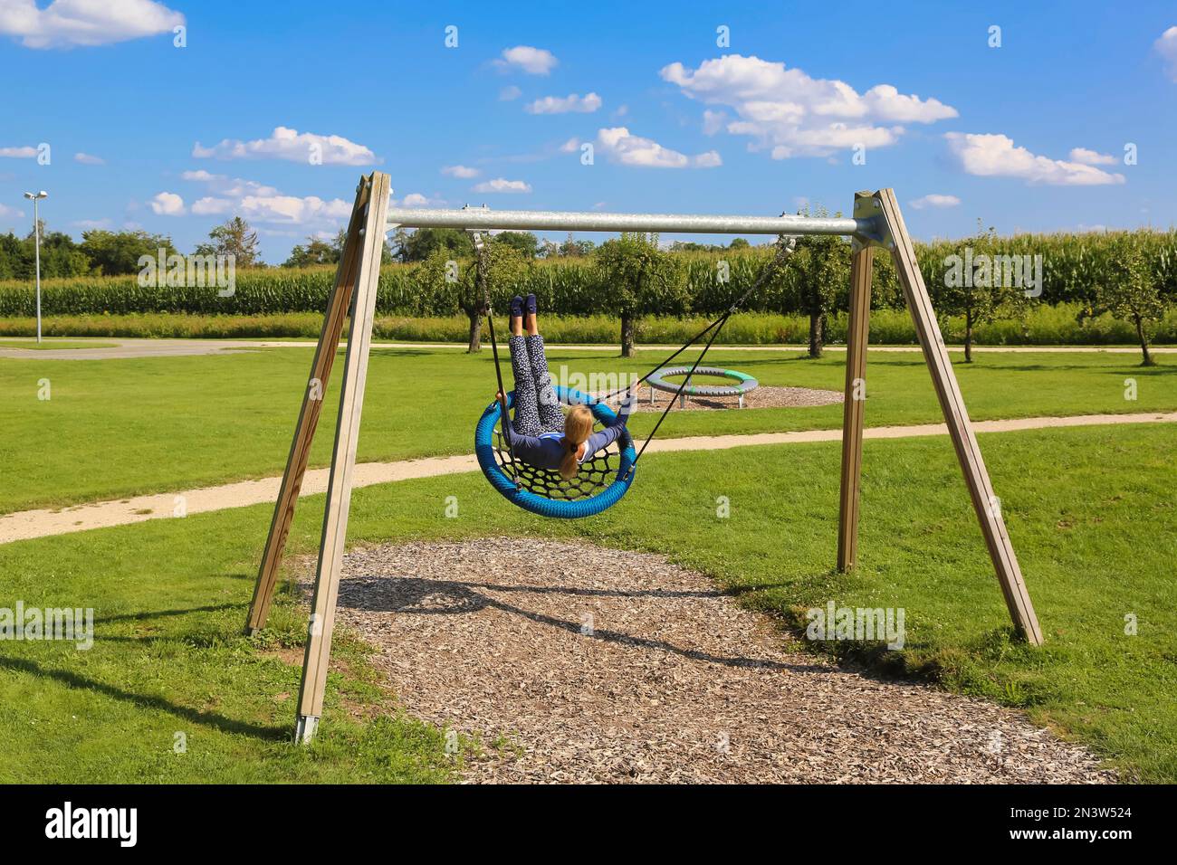 Woman on swing in the Garden of Eden, Generation Active Park, Sensory ...