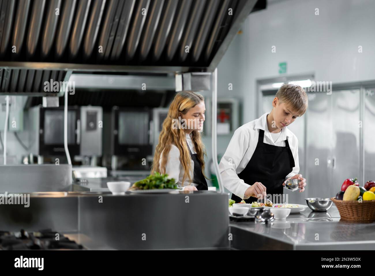 Students are learning to cook in a culinary institute with a standard ...