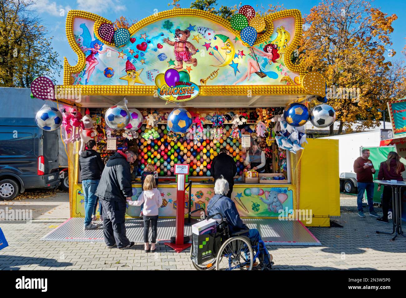 Danelia Haas Lady Luck, throwing arrows at balloons, amusement ride ...