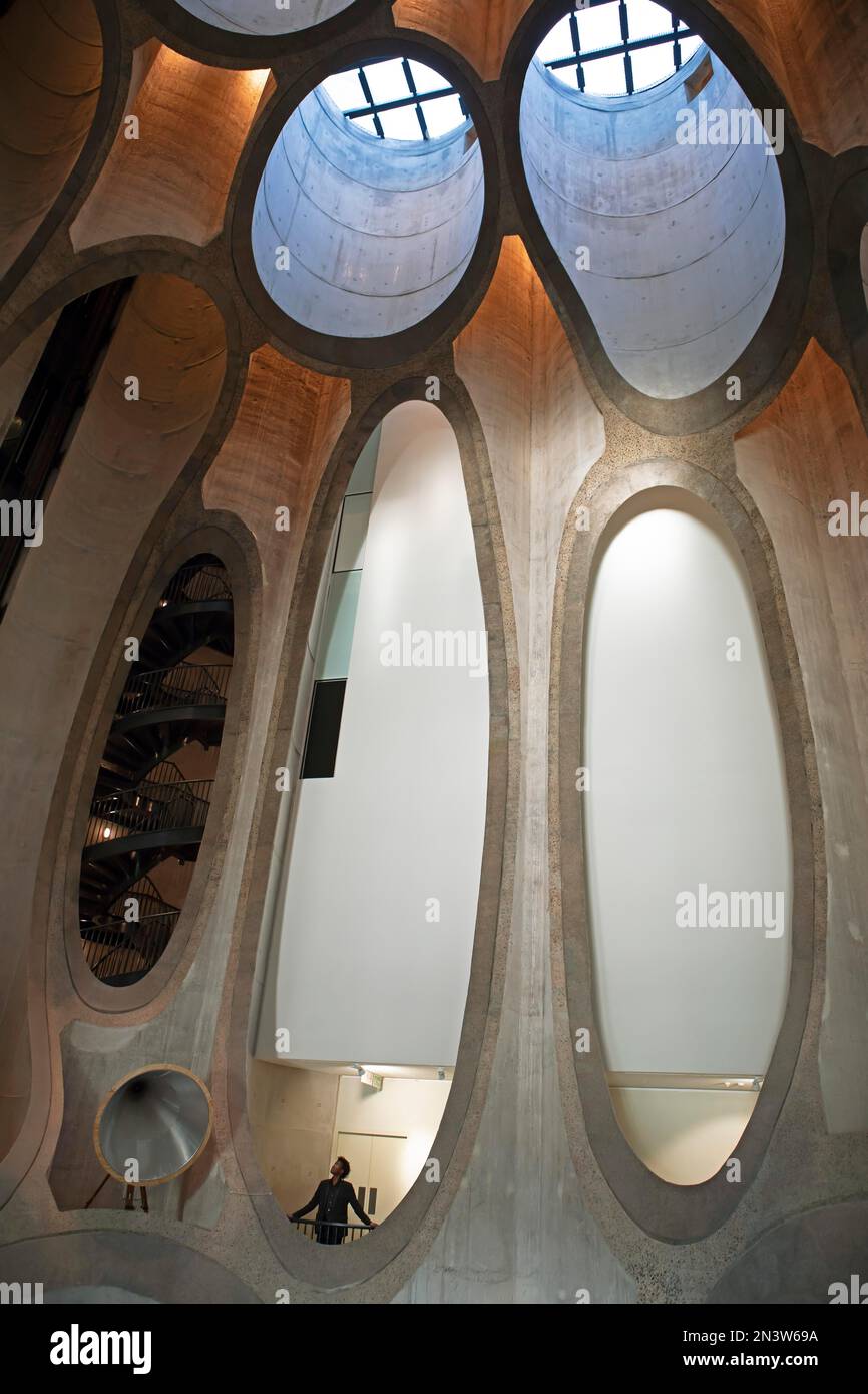 A man looks into the futuristic entrance hall of the Zeitz MOCAA Museum ...