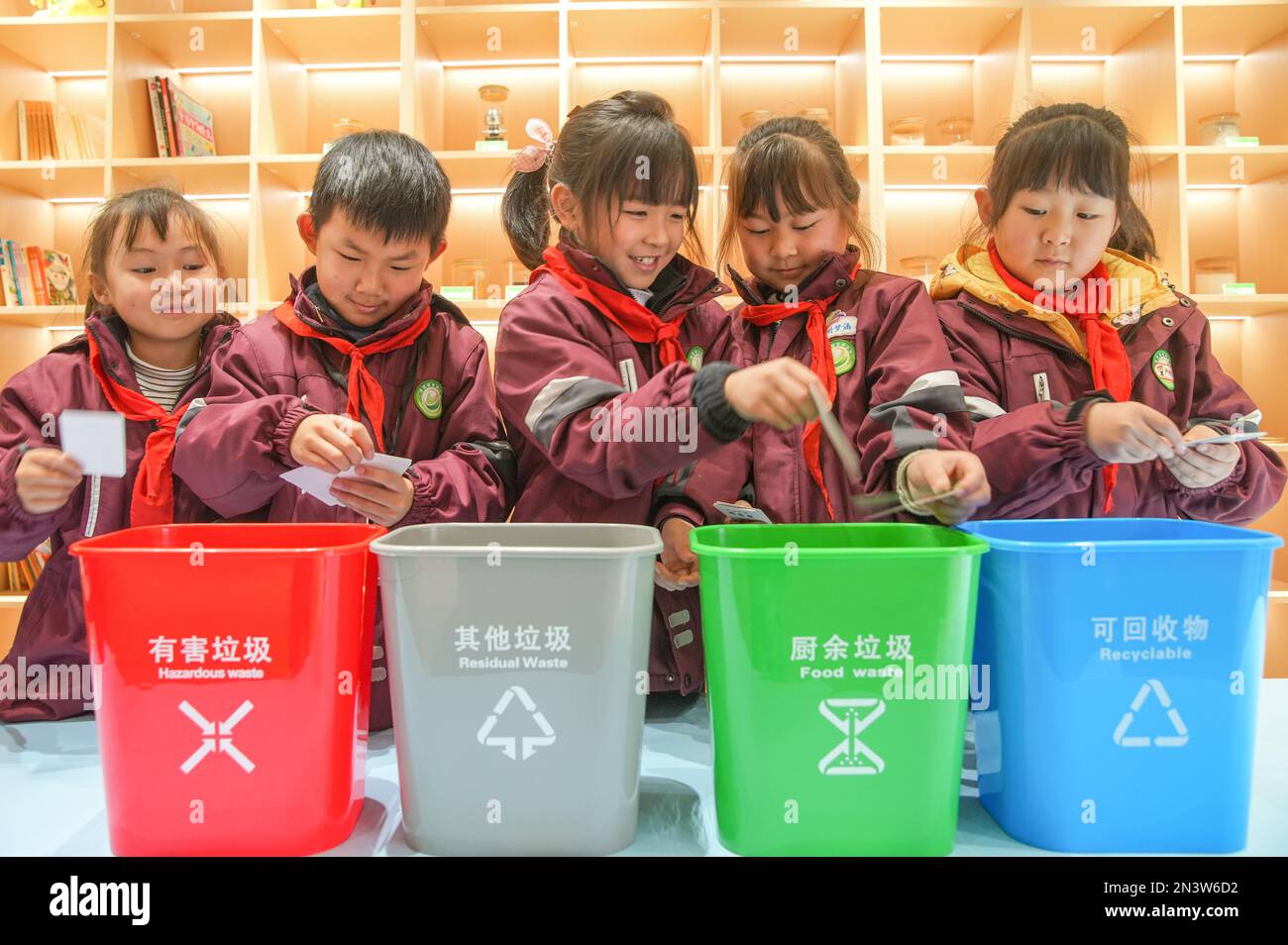 HUZHOU, CHINA - FEBRUARY 8, 2023 - Primary school students play a garbage sorting game in Huzhou ...