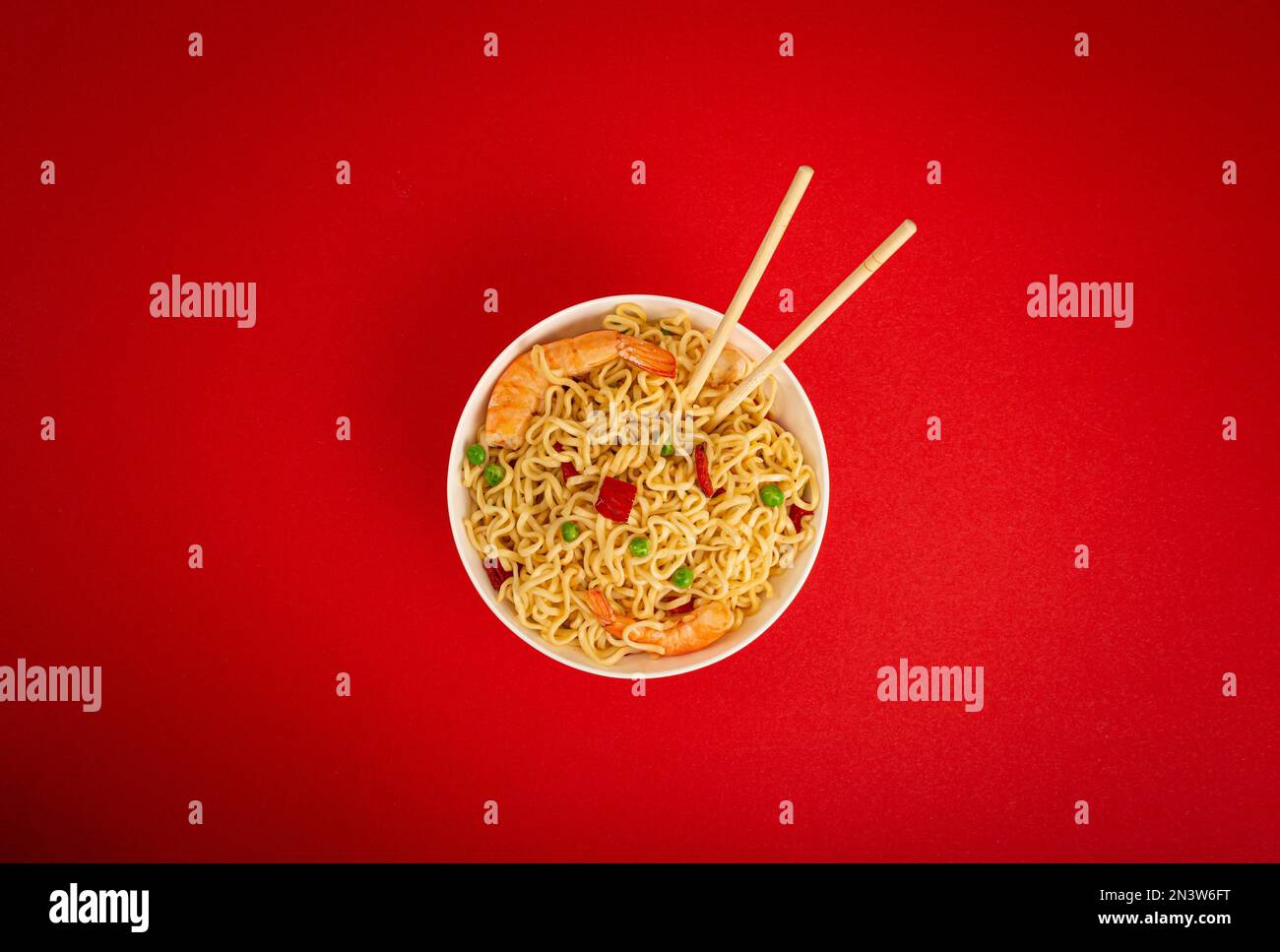 Asian Chinese noodles top view flat lay with shrimps and vegetables in ...
