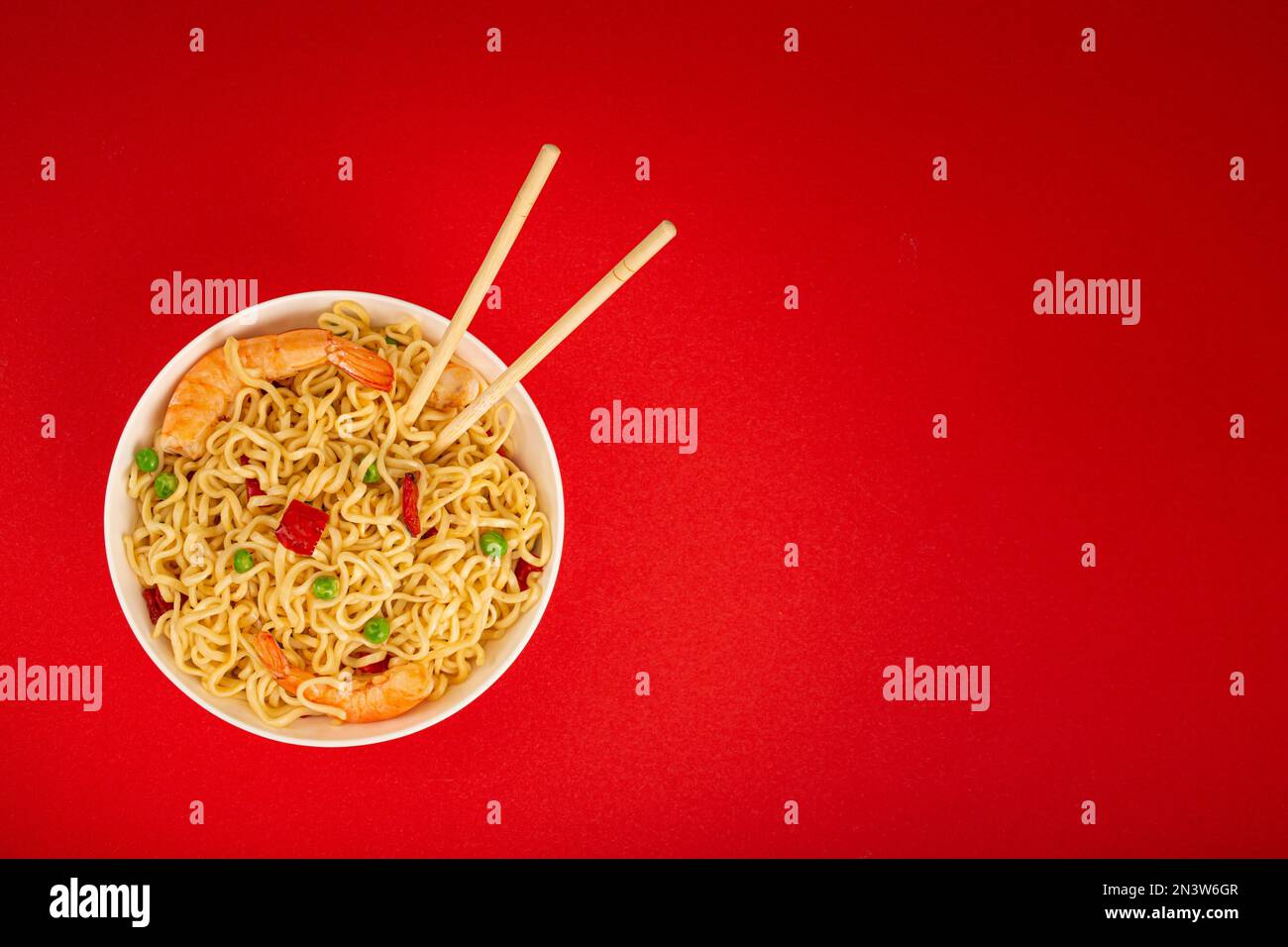 Asian Chinese noodles top view flat lay with shrimps and vegetables in ...