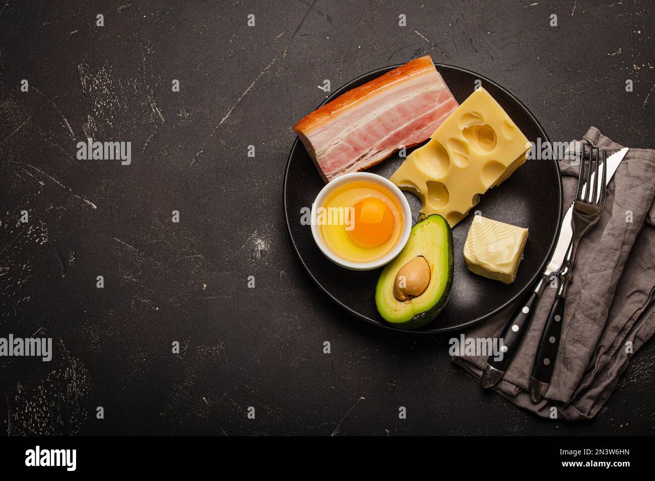 Main keto foods as butter, olive oil, fried egg, avocado, fat meat ...