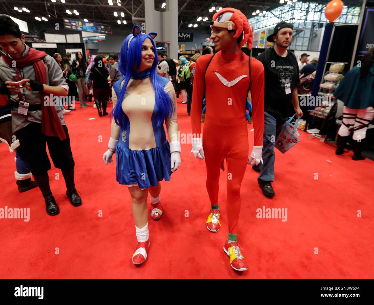 A Sonic the Hedgehog character, left, and a Knuckles character attend ...