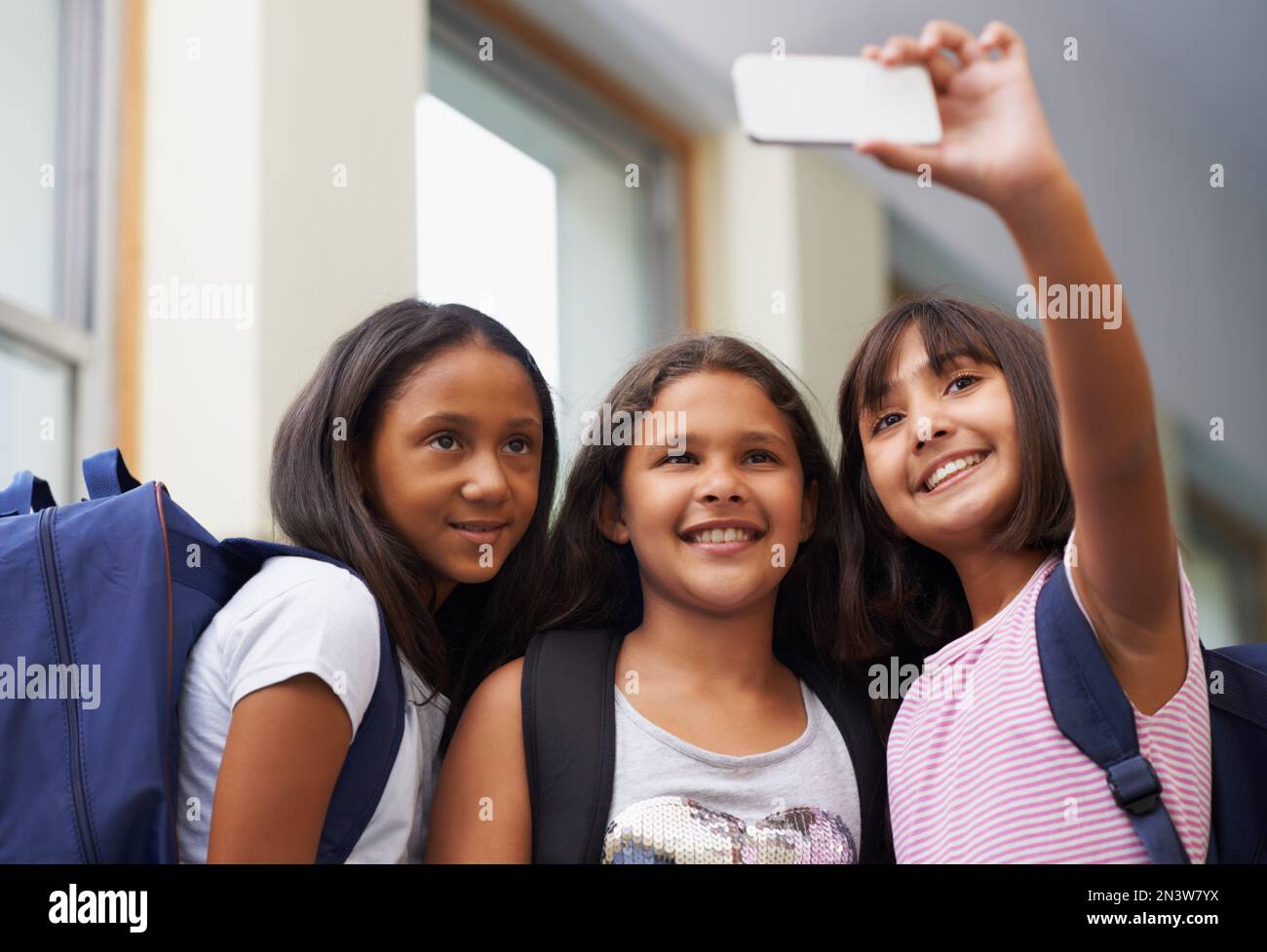 Making memories. Three school friends taking a self-portrait with their ...