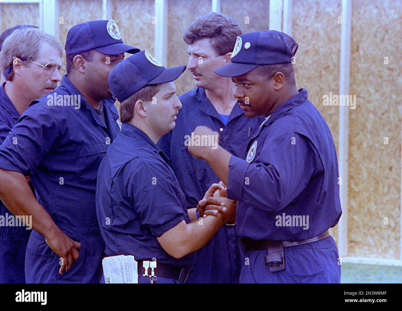 Rescue team members congratulate each other after successfully storming ...