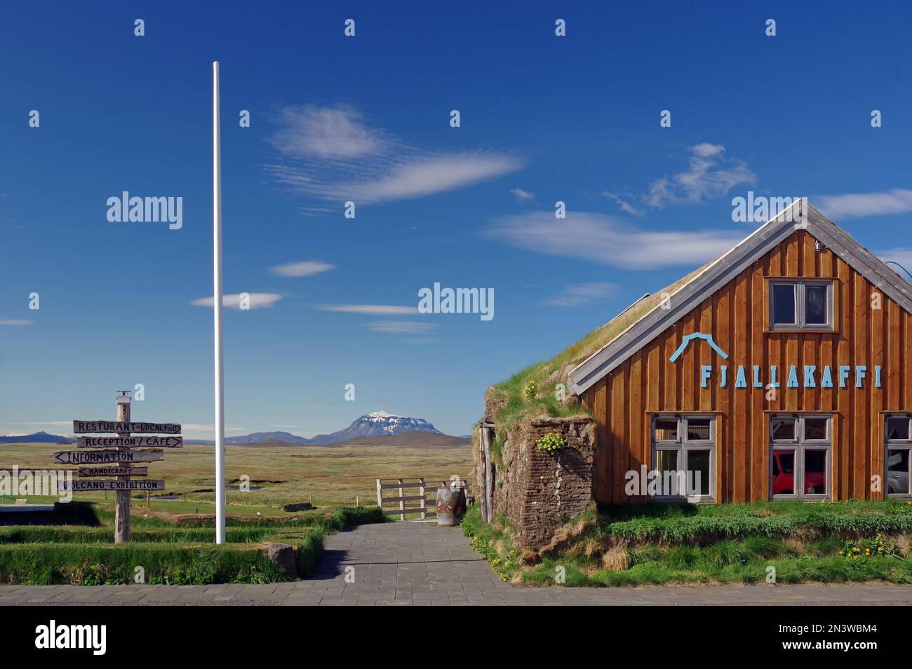 Small cafe in traditional building, signpost, Herdubreid, Table Volcano ...