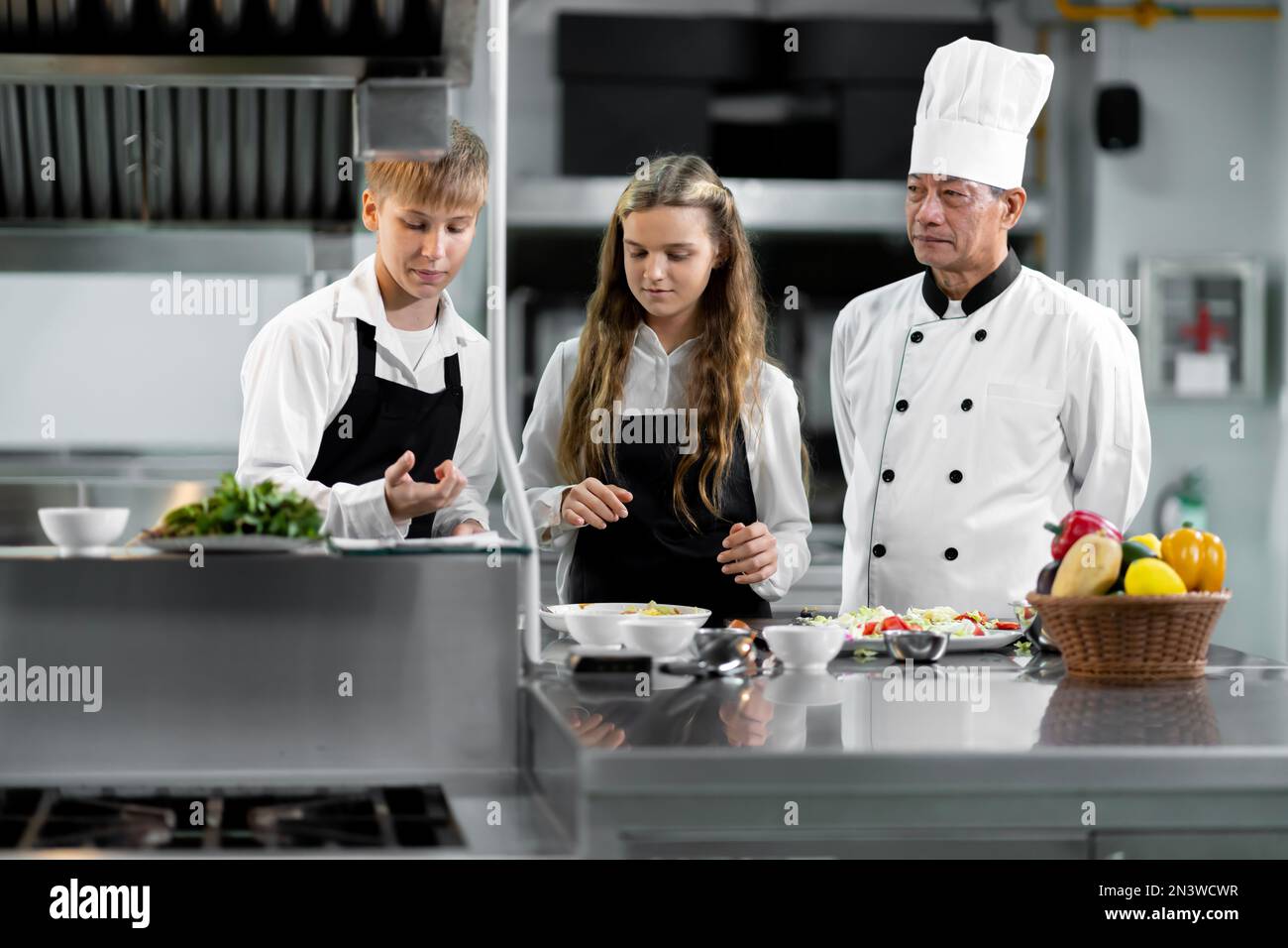 Students are learning to cook in a culinary institute with a standard ...