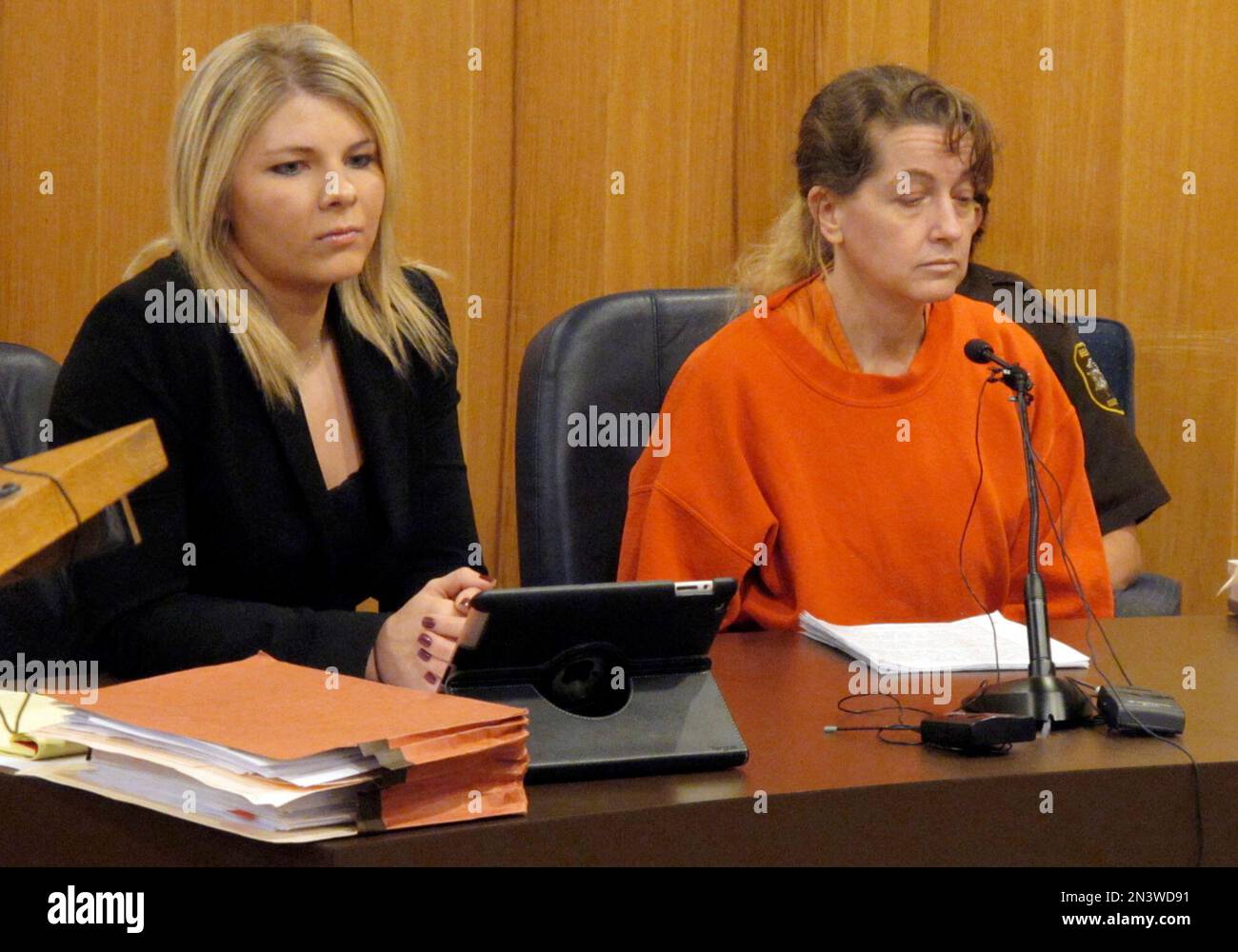 Kelli Stapleton, right, and defense attorney Heidi Hodek look on ...