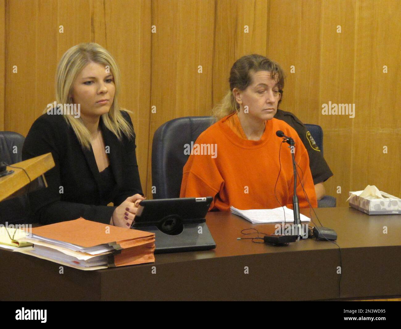 Kelli Stapleton, right, and defense attorney Heidi Hodek look on ...