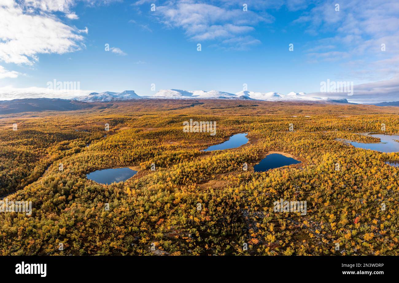 Autumn fell landscape and lakes with snow-covered mountains, Abisko ...