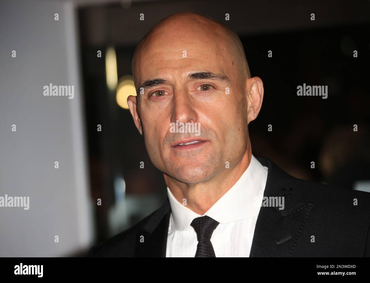 British actor Mark Strong poses for photographers upon arrival at the ...
