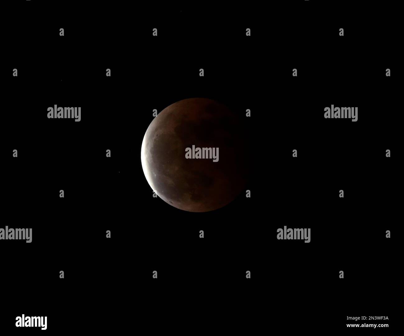 The deep orange color of the moon slowly fades during a Total Lunar ...