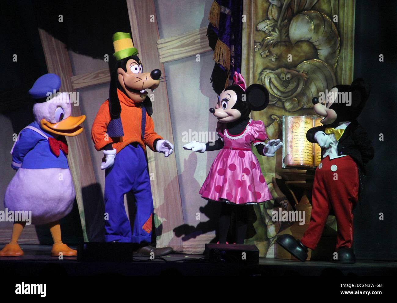 Mickey and Minnie Mouse, Donald Duck and Goofy are on the stage during ...