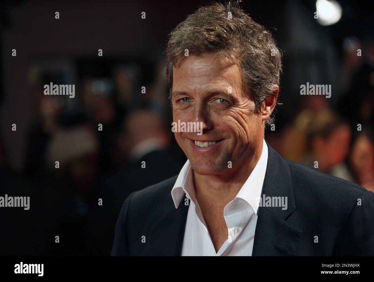 British actor Hugh Grant poses for photographers upon arrival at at the ...
