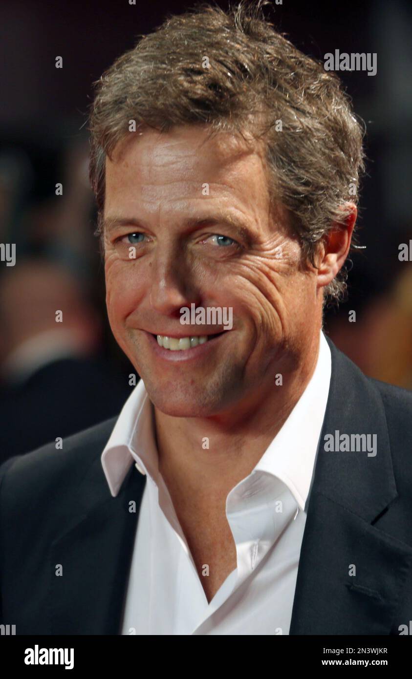 British actor Hugh Grant poses for photographers upon arrival at at the ...