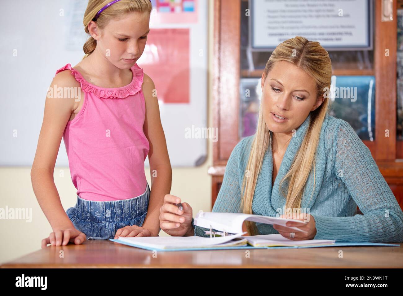 Marking like theres no tomorrow. A young teacher marking tests Stock ...