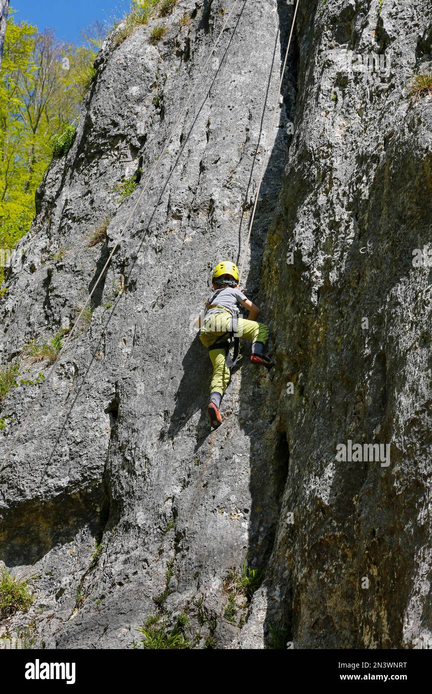 Climbing, boy, child in the rock face, rock labyrinth, Blaubeuren ...