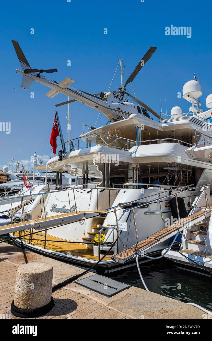 Luxury yacht with helicopter on deck anchored in the harbour of Saint ...